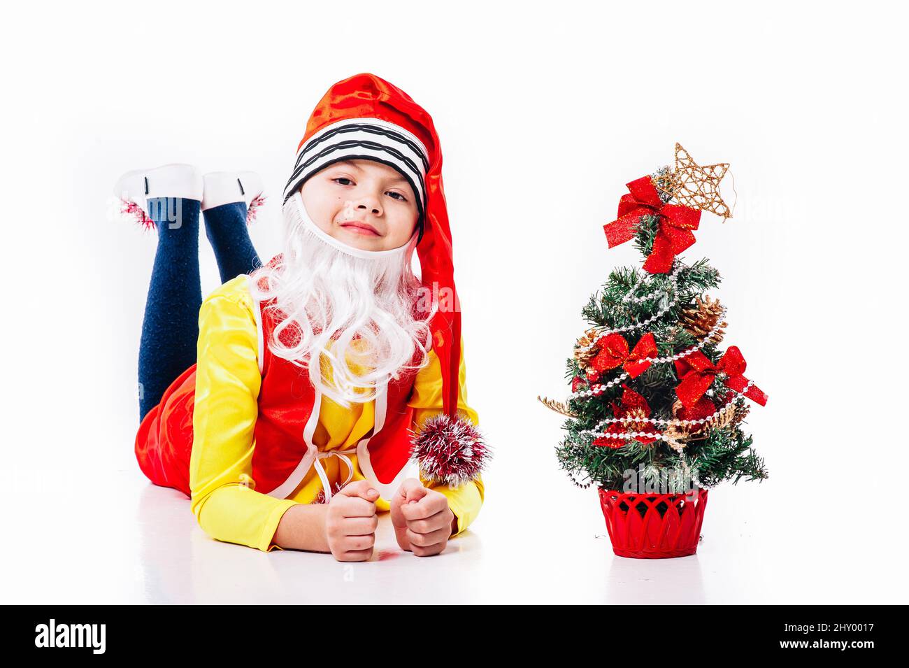 A baby dressed as a elf. isolated. Santa's helper. boy in suit of dwarf ...