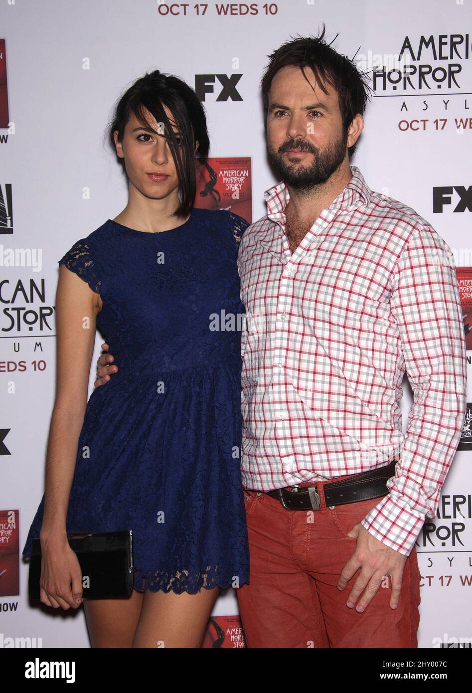Jason Gann & Date attending the premiere of "American Horror Story ...