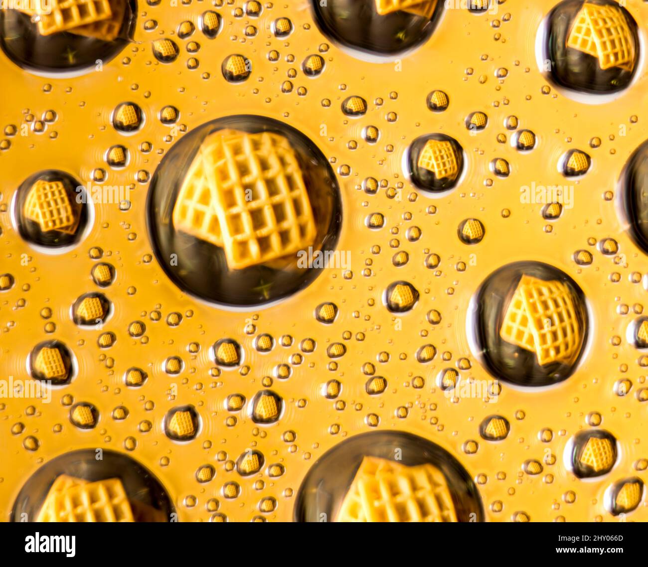 Creative macro food still-life of breakfast waffles reflected in water ...
