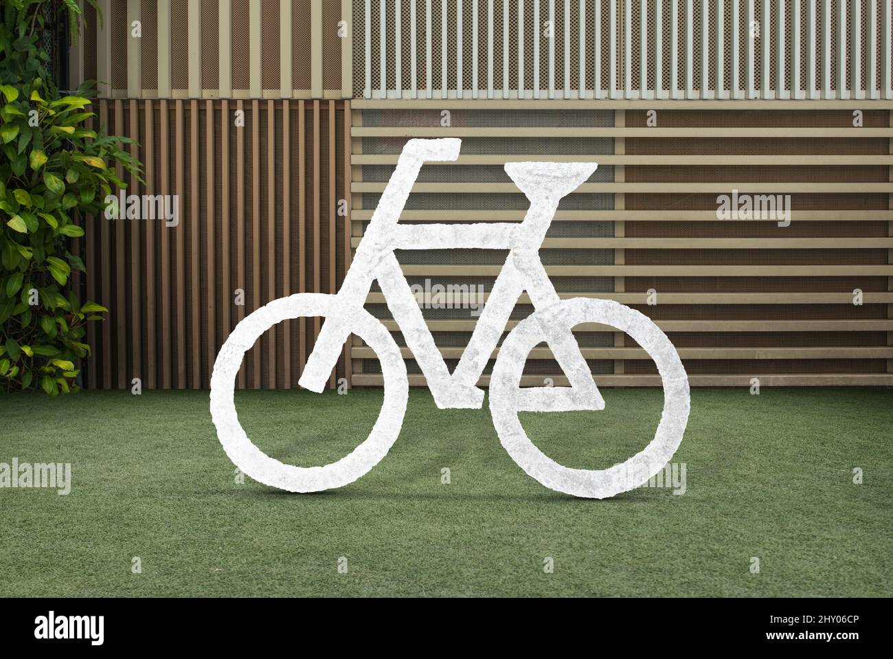 Bicycle sign, bike cycling on grass wooden wall background Stock Photo ...