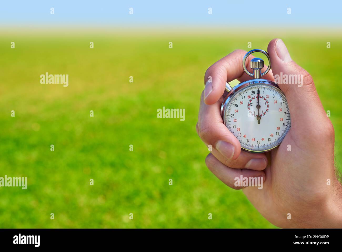 Ready for the time trials. Cropped shot of a hand holding a stopwatch ...