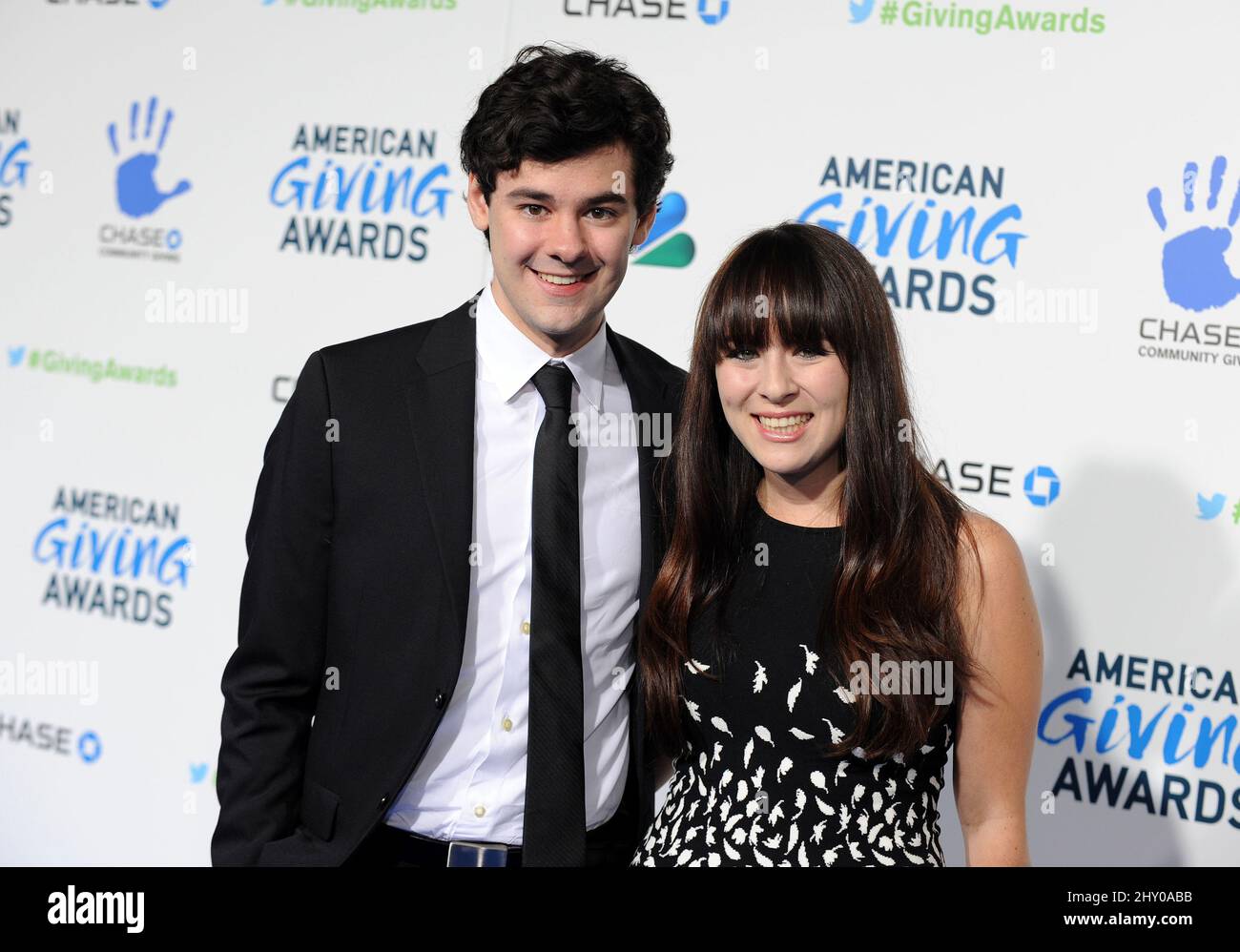 Brendan Robinson and guest arriving for the 2012 American Giving Awards ...