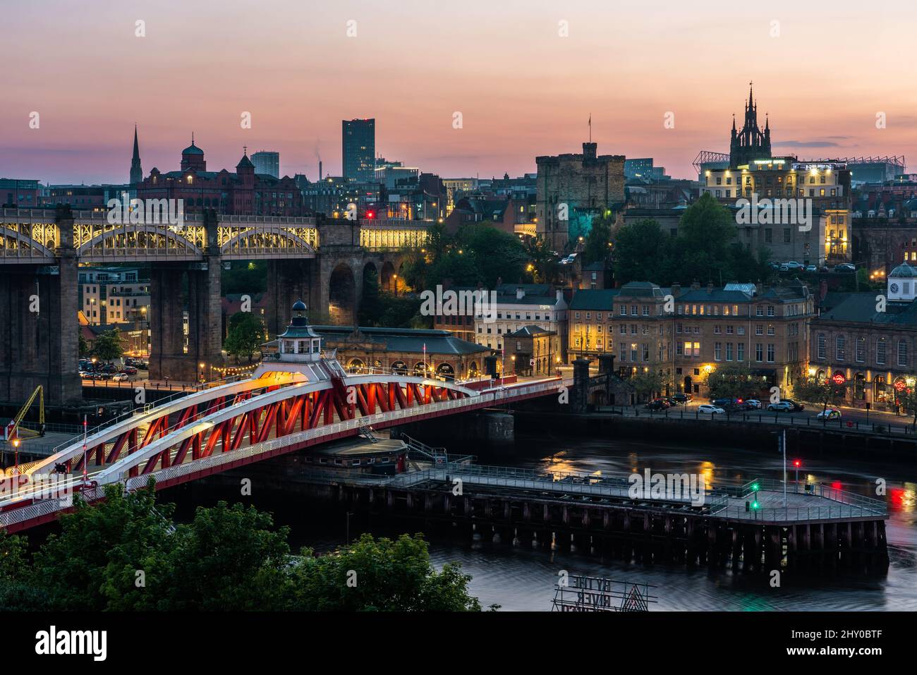 Late sunset early evening cityscape of the Swing Bridge and historic ...