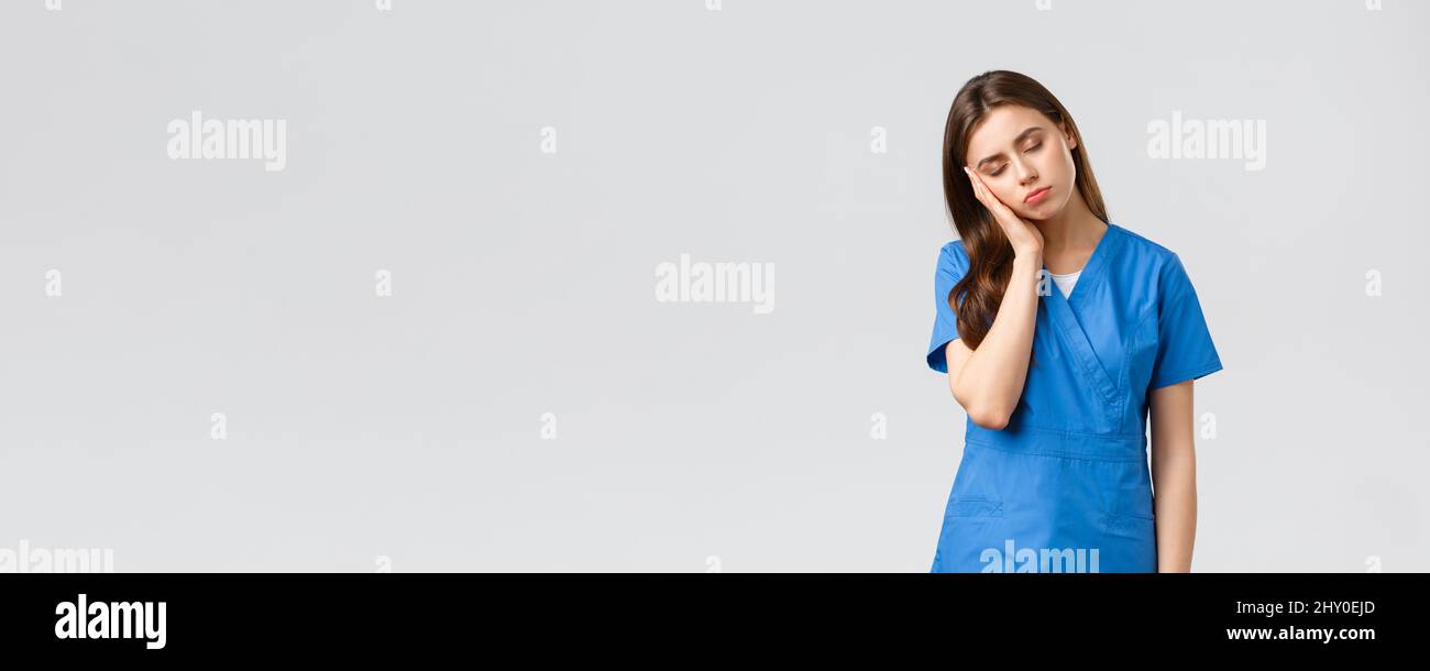 Healthcare workers, prevent virus and medicine concept. Tired sleepy ...