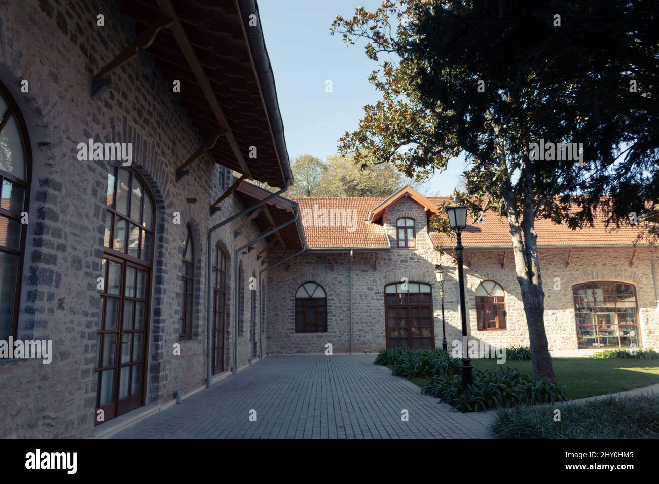 A beautiful huge house. Triangle roof. Stone house in autumn season ...