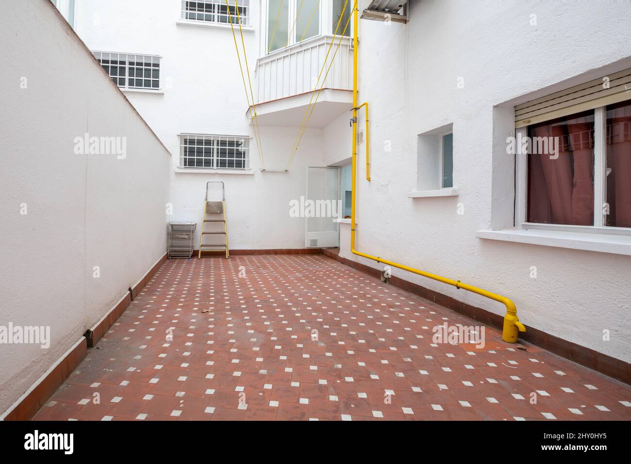 Low floor terrace with clay floor and white painted walls Stock Photo ...