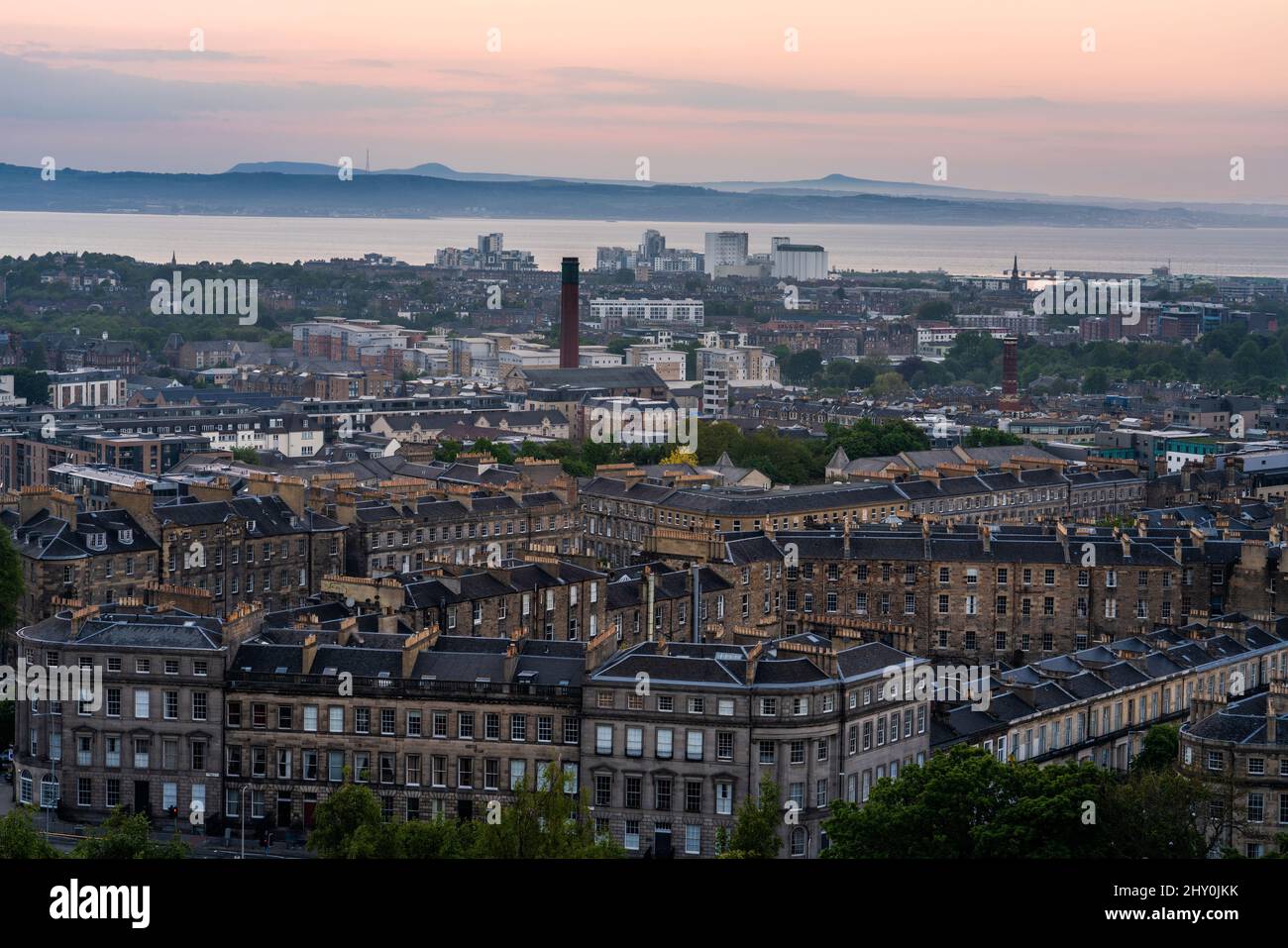 Edinburgh cityscape on the east side of the city with the ocean in the ...