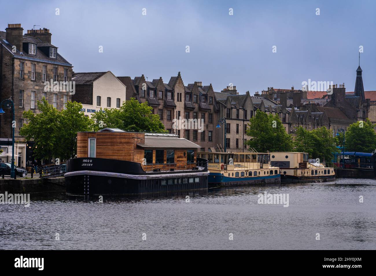 Leith buildings and boats docked along the waterfront of the port in ...