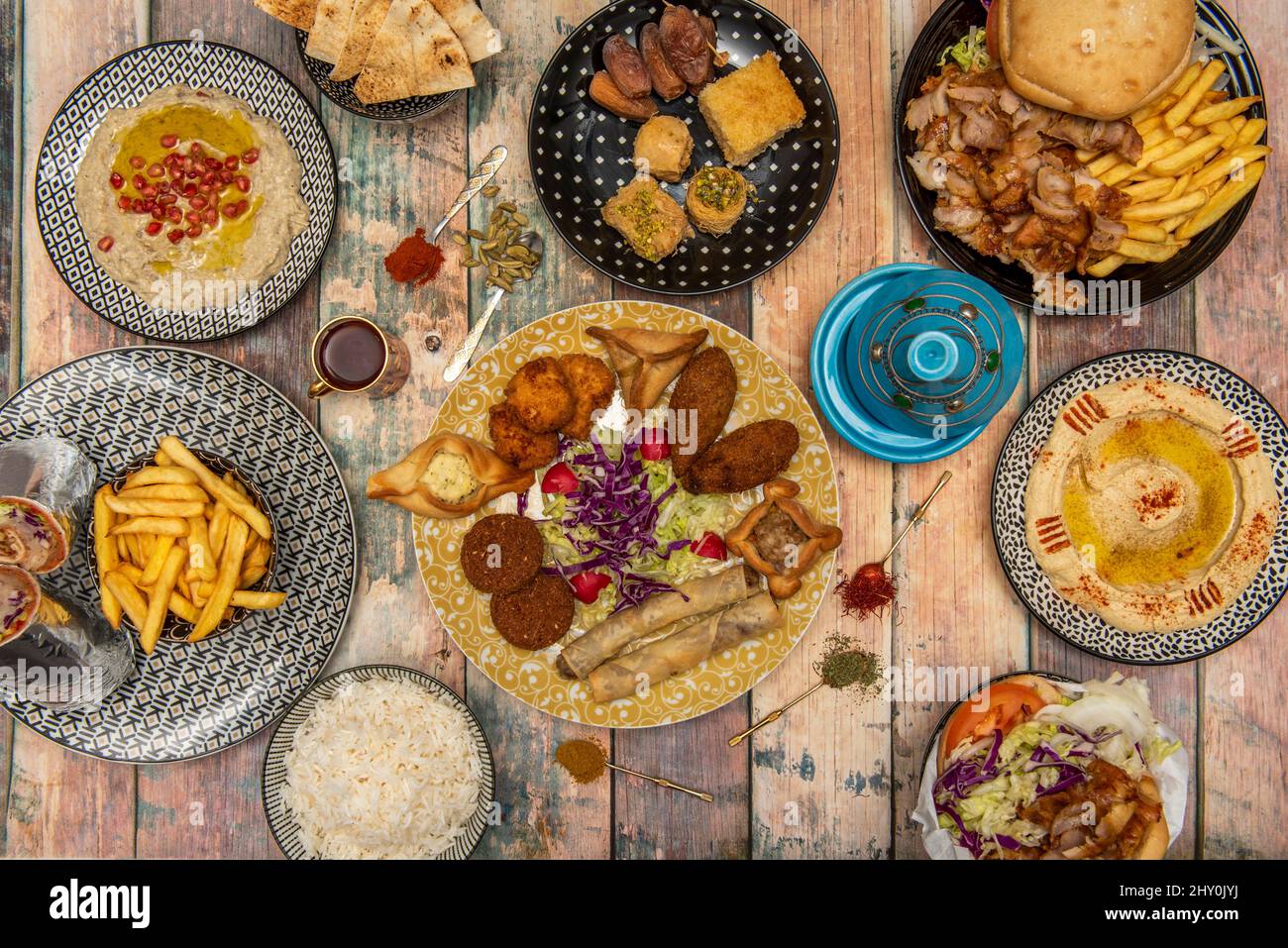 Asian food and kebab dishes set, basmati rice, falafel, durum, hummus ...