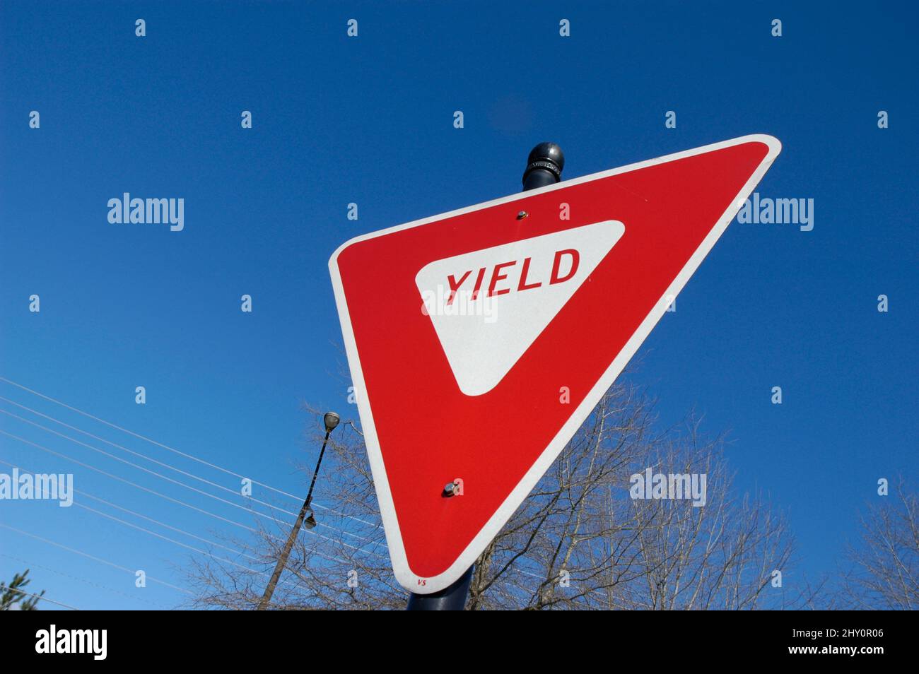 Yield Traffic Sign on roadway Stock Photo - Alamy