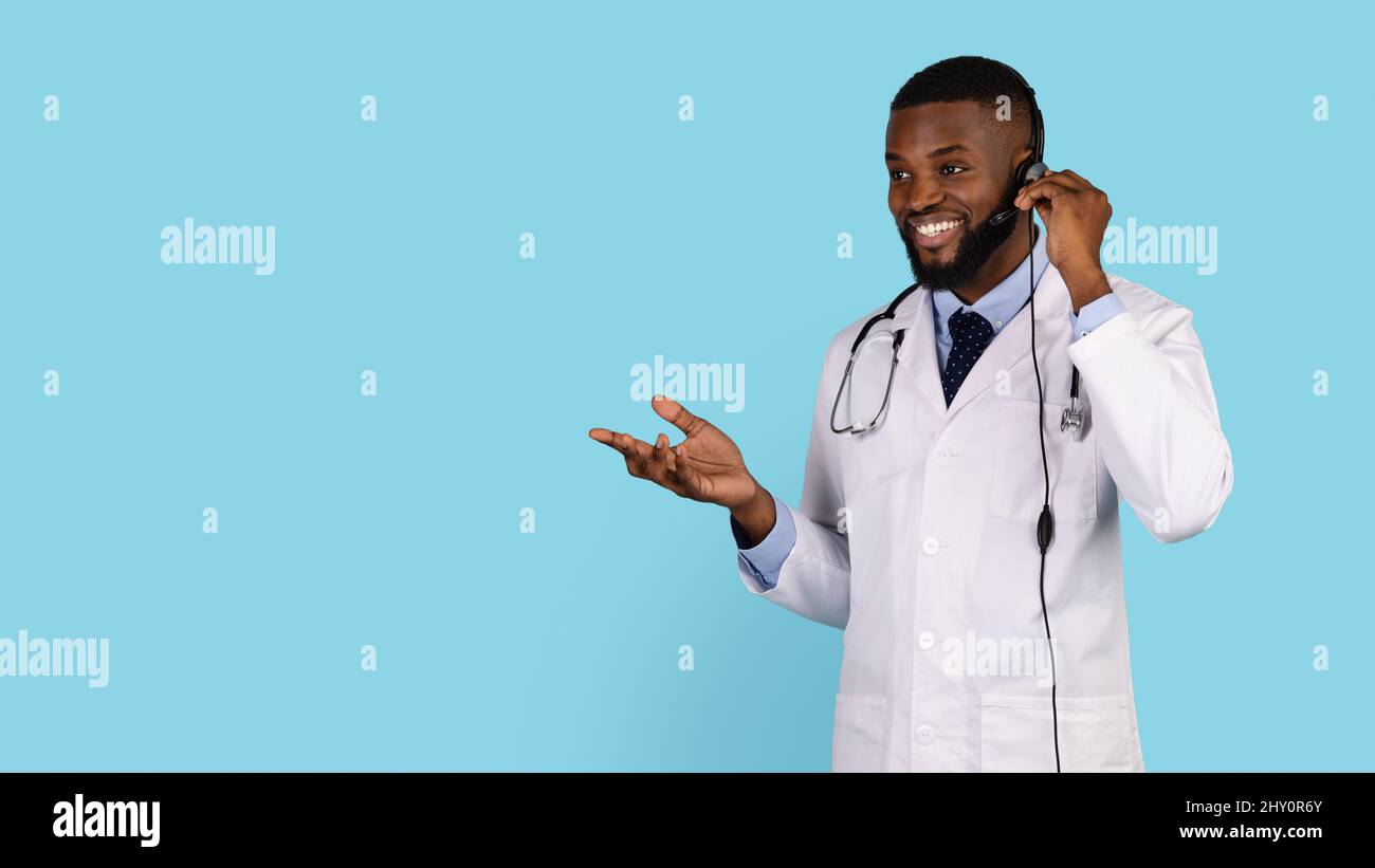 Online Consultancy. Smiling Black Doctor Wearing Headset Talking With ...