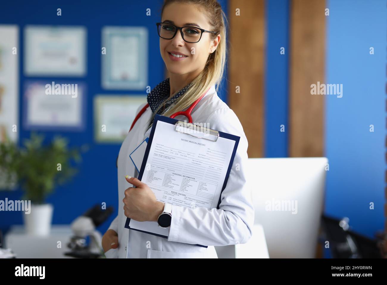 Qualified clinic worker in hold patient medical history posing in ...