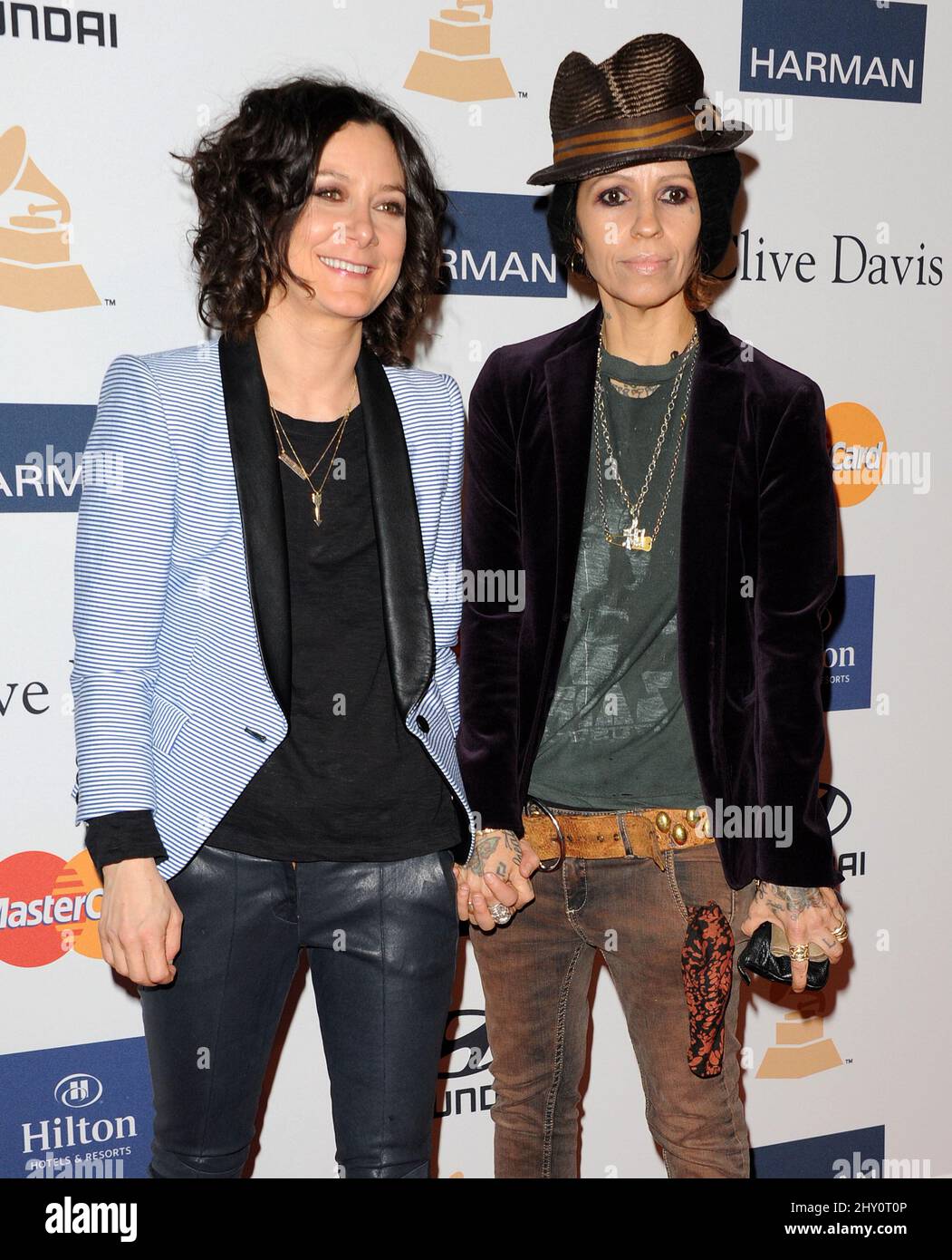 Sara Gilbert and Linda Perry attending the 2013 Clive Davis Pre-Grammy ...