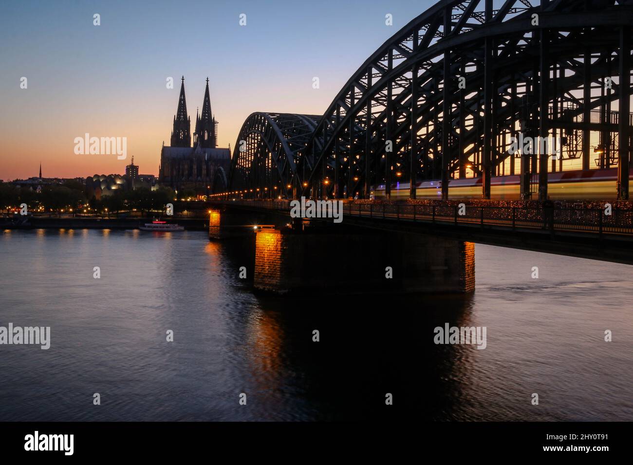 The Hohenzollern Bridge and Cologne Cathedral in the city of Cologne ...