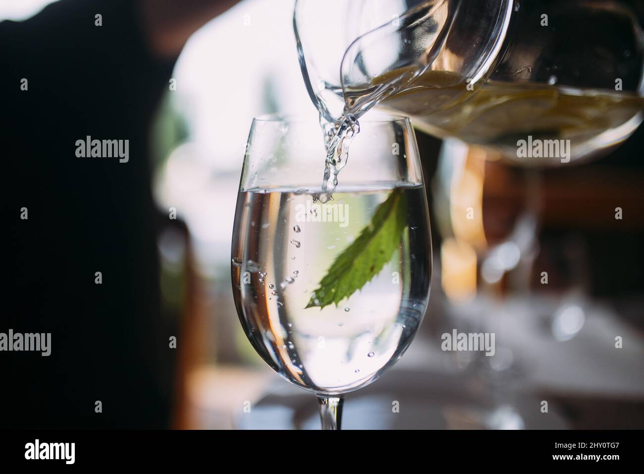 Selective shot of Gin and tonic mixing by the pretender Stock Photo - Alamy