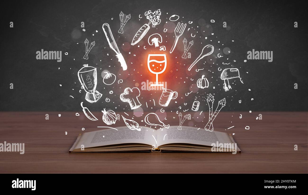 Open recipe book with food related icons above Stock Photo - Alamy