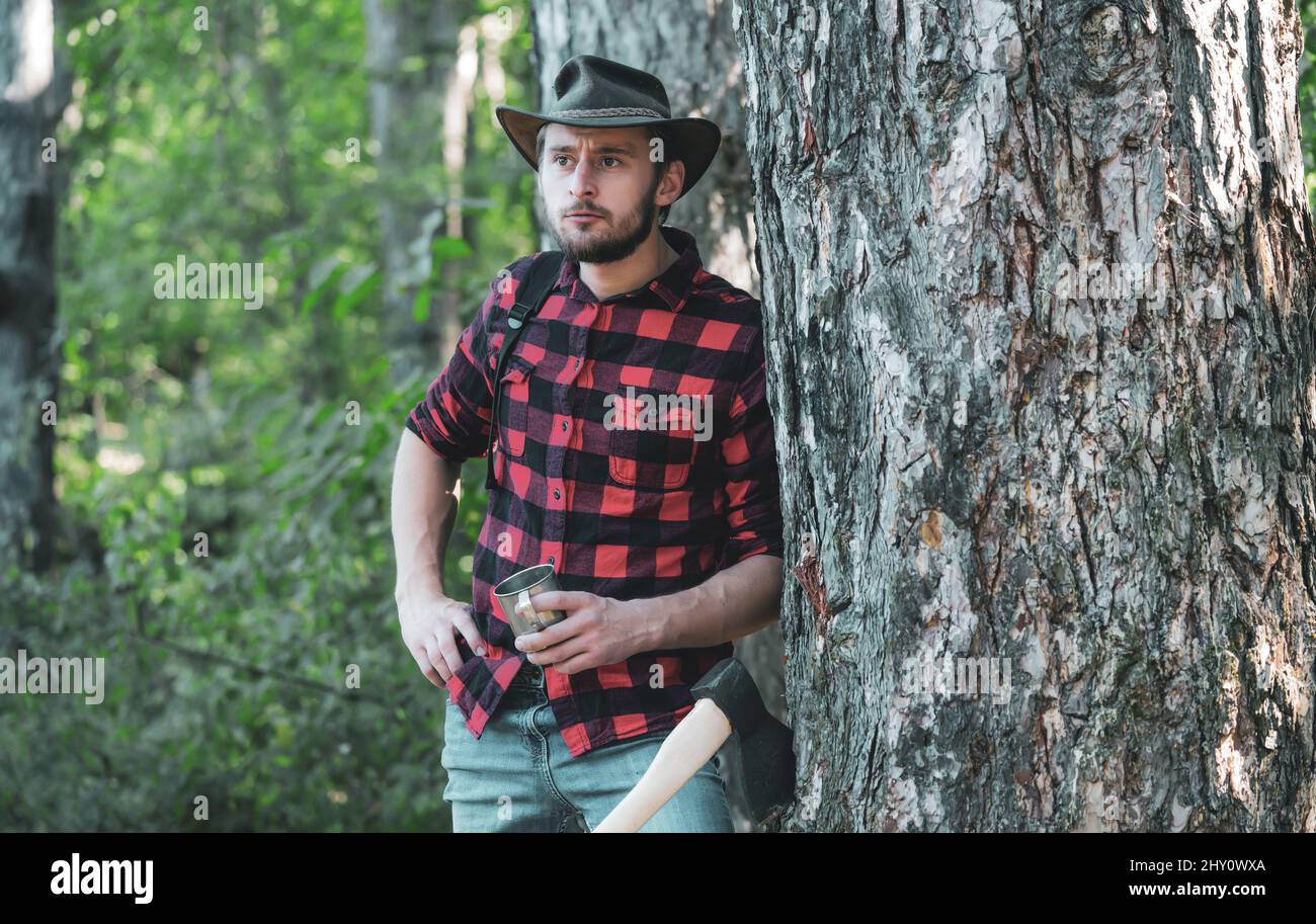 Lumberjack with axe on forest background. Man doing mans job. A ...