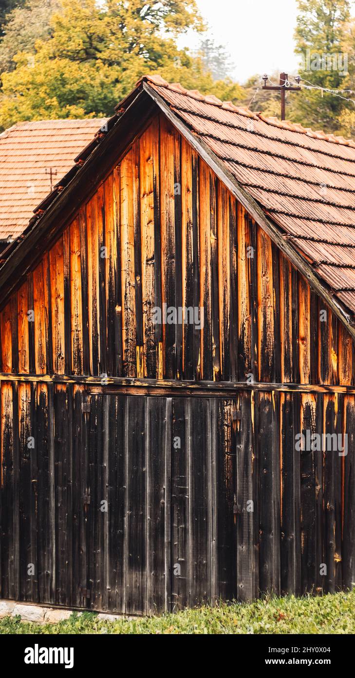 Beautiful view of an old wooden house on a farm Stock Photo - Alamy