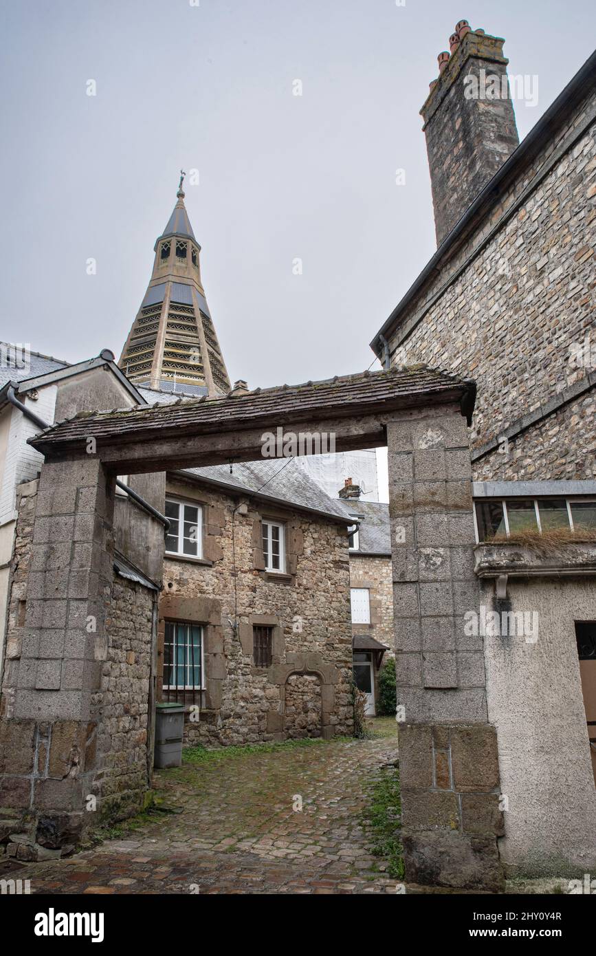 Architecture of a town in Normandy with a church tower and old houses ...