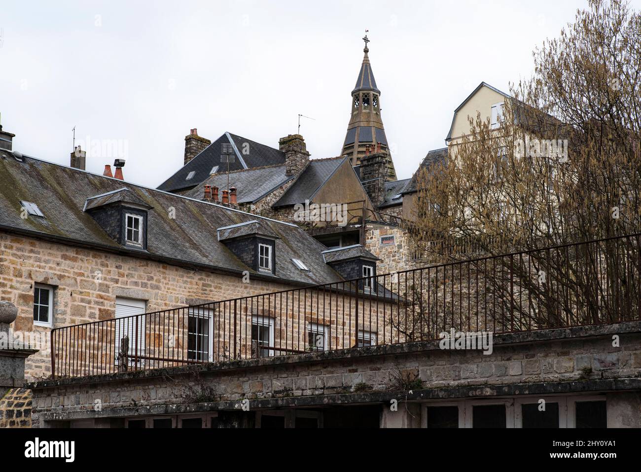 Architecture of a town in Normandy with a church tower and old houses ...