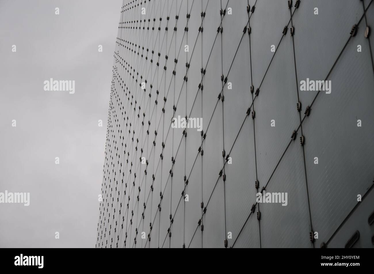 Grayscale low angle shot of the modern building windows pattern Stock ...