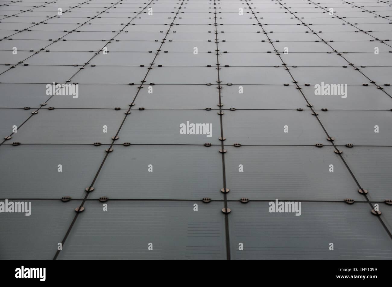 Grayscale low angle shot of the modern building windows pattern Stock ...