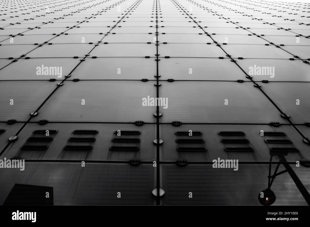 Grayscale low angle shot of the modern building windows pattern Stock ...