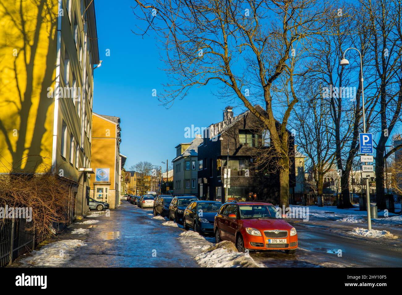 Street view surrounded by cars and buildings in the Kalamaja ...