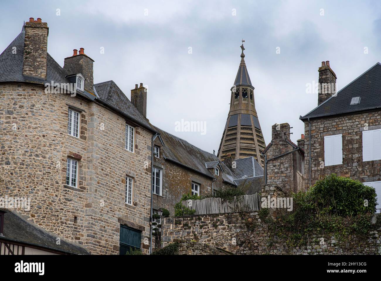 Architecture of a town in Normandy with a church tower and old houses ...