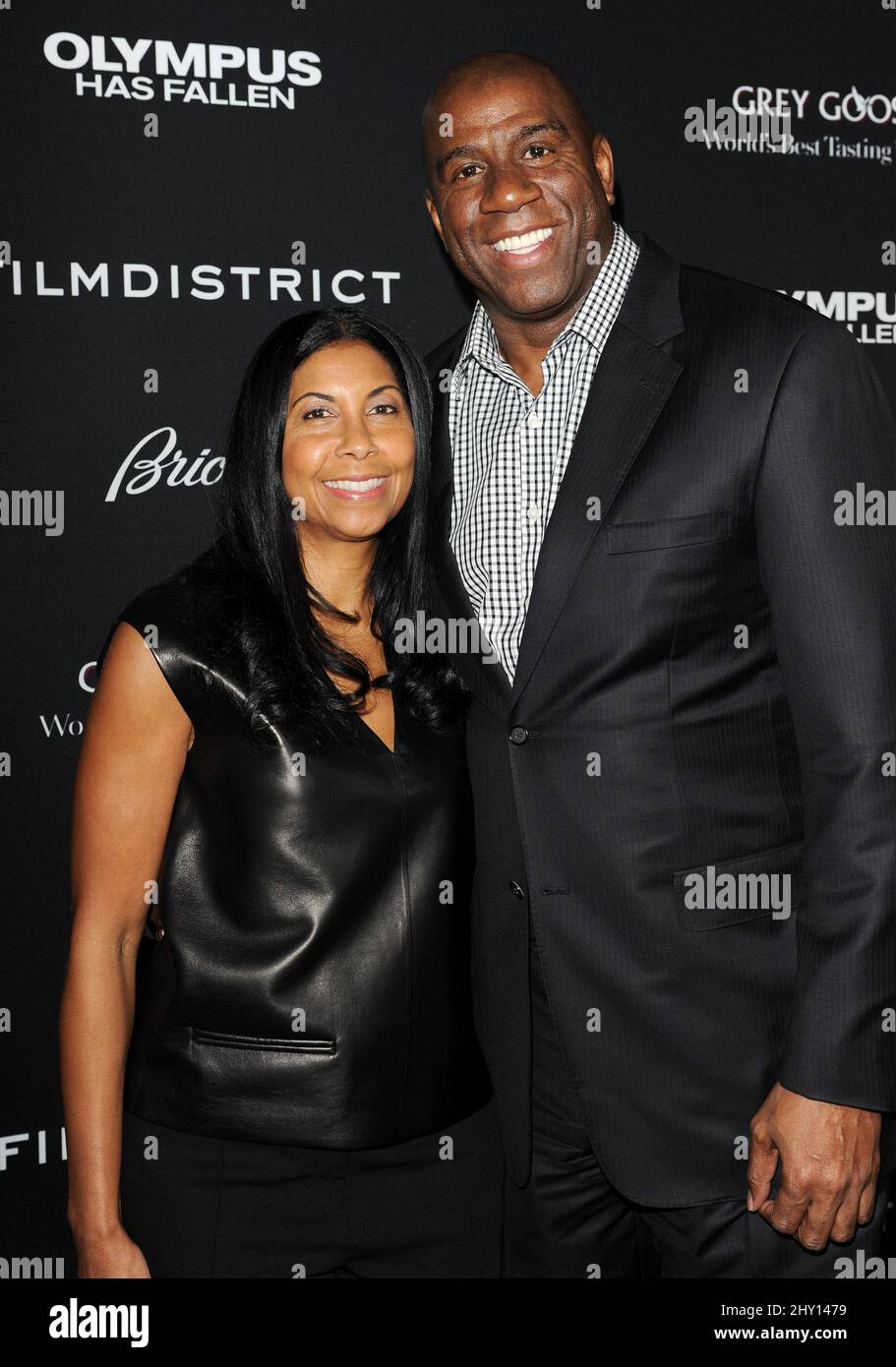 Magic Johnson and wife Cookie attending the premiere of "Olympus Has ...