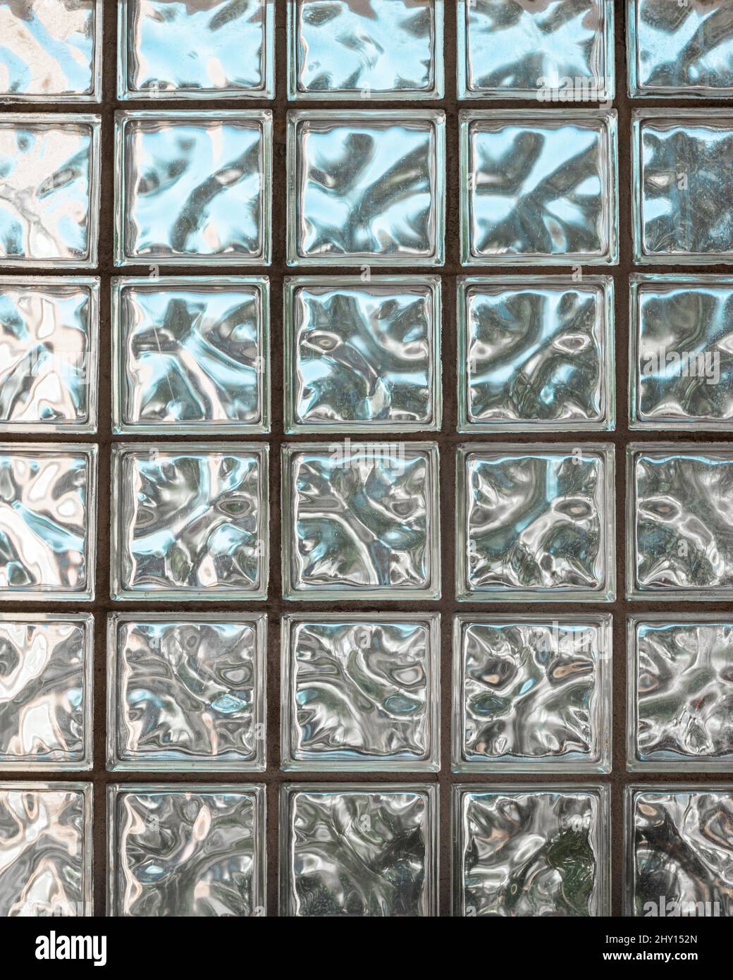 Close-up shot of a glass block wall in one of the buildings of ...