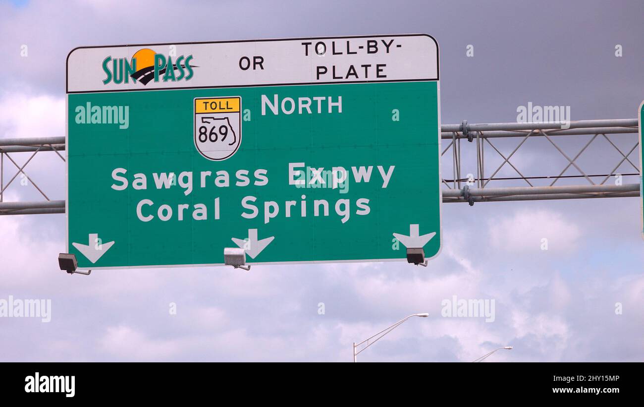 Street sign on the highway of Florida showing Coral Springs and ...