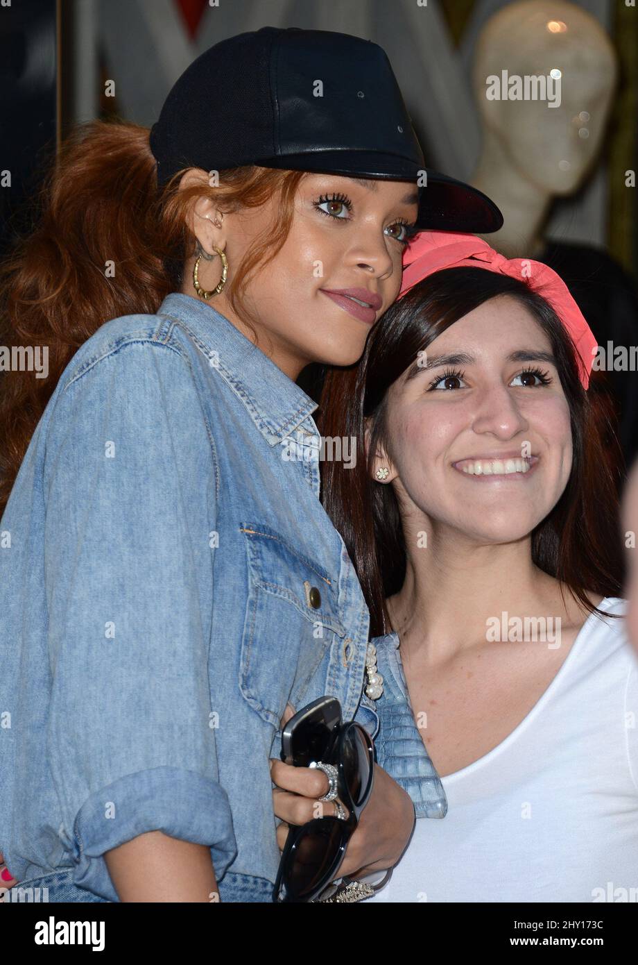 Rihanna and a fan seen at Rodeo Drive in Beverly Hills, California ...