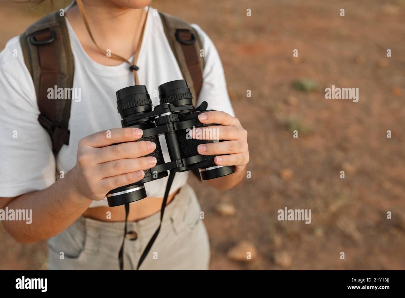 Woman binoculars in desert hi-res stock photography and images - Alamy