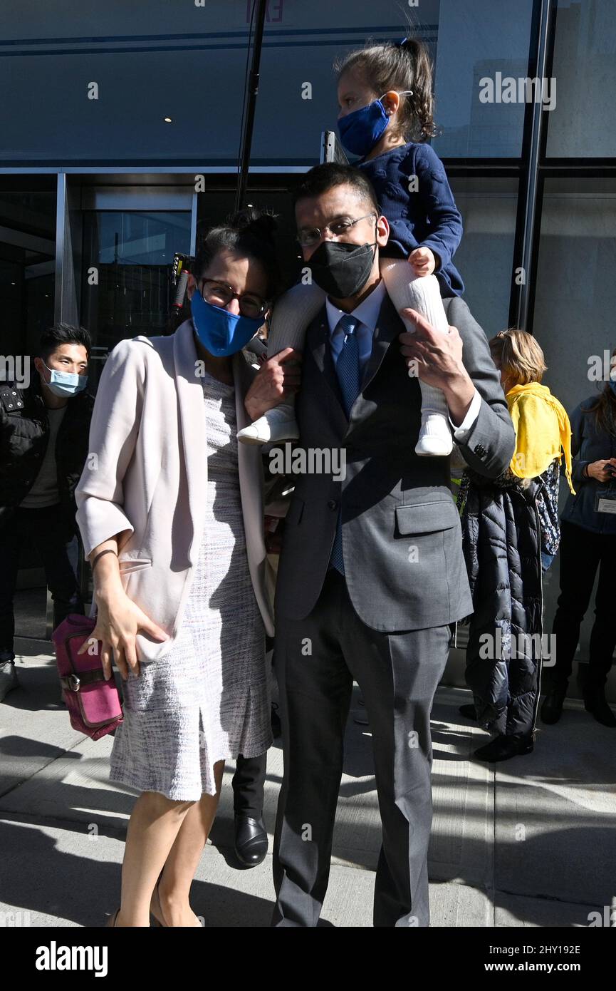 Carrying his daughter Ava Lucia on his shoulders and his wife Melissa ...