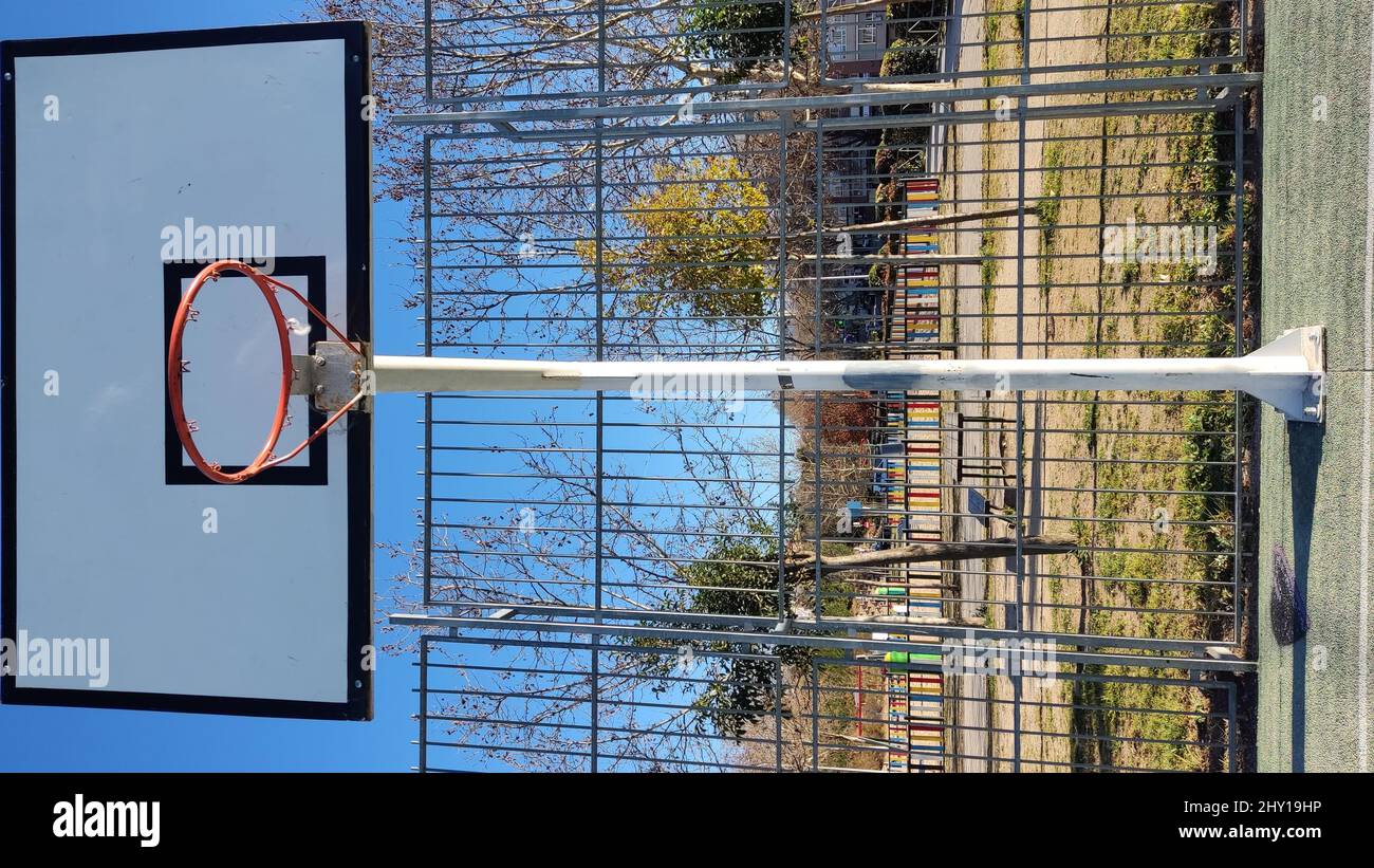 Closeup of a basketball hoop in a park on a sunny day Stock Photo - Alamy