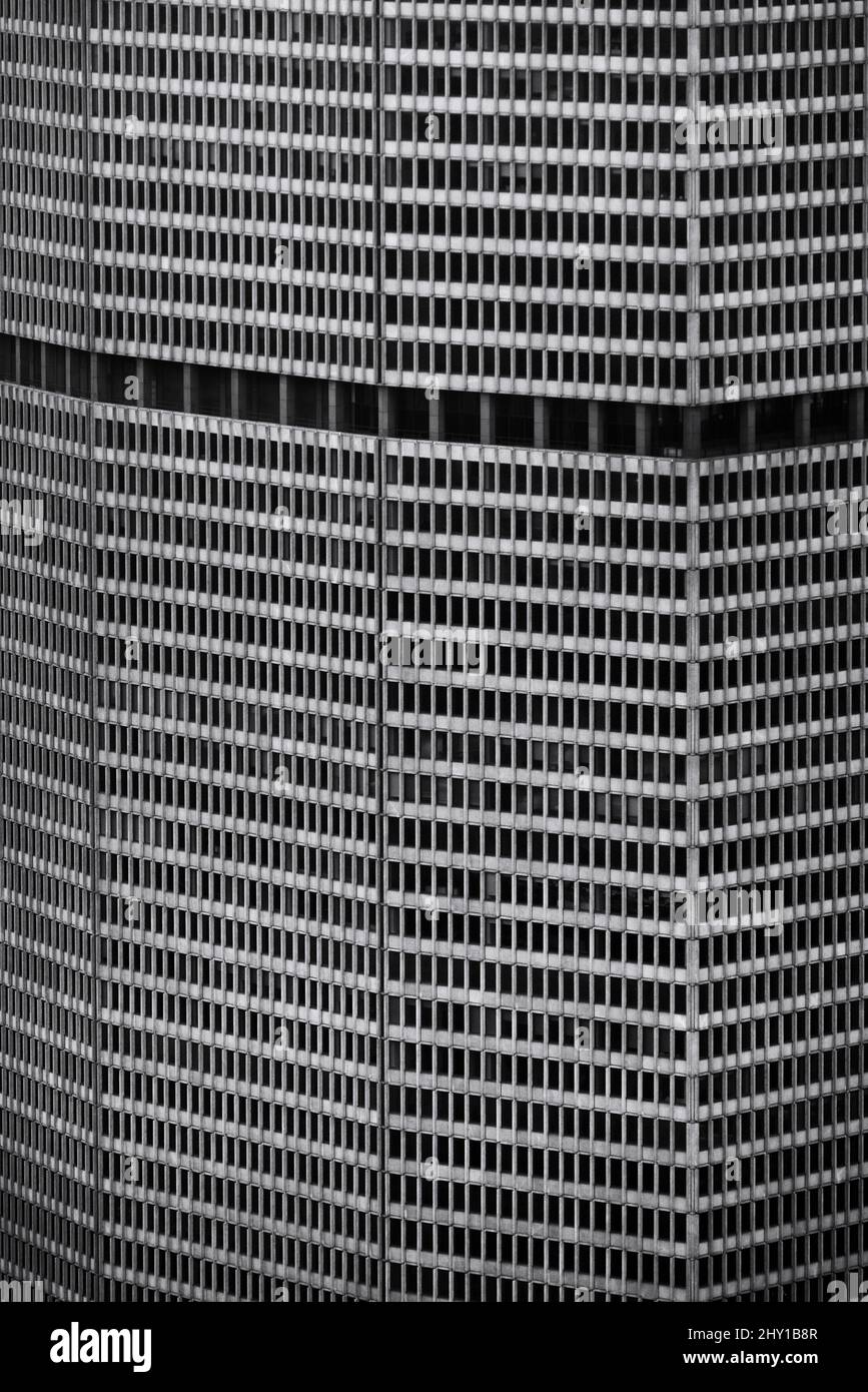 High rise building with glass mirrored walls located on street of ...
