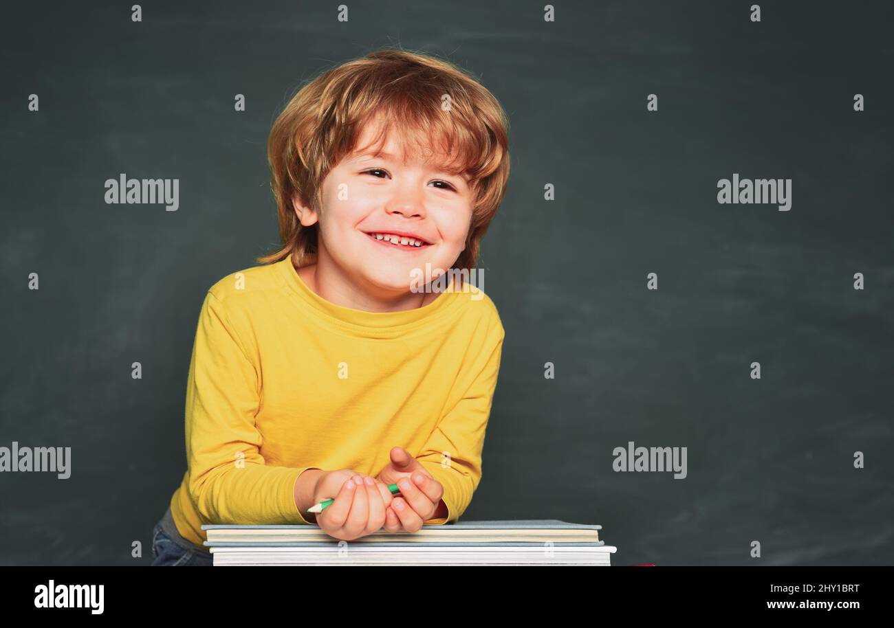 Little student boy happy with an excellent mark. Little children at ...