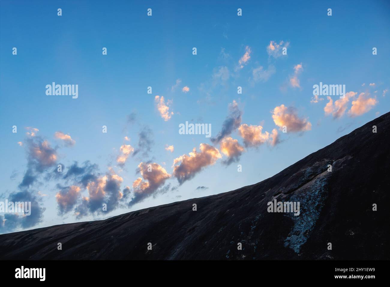 Scenic view of an evening sky background with rock foreground Stock ...