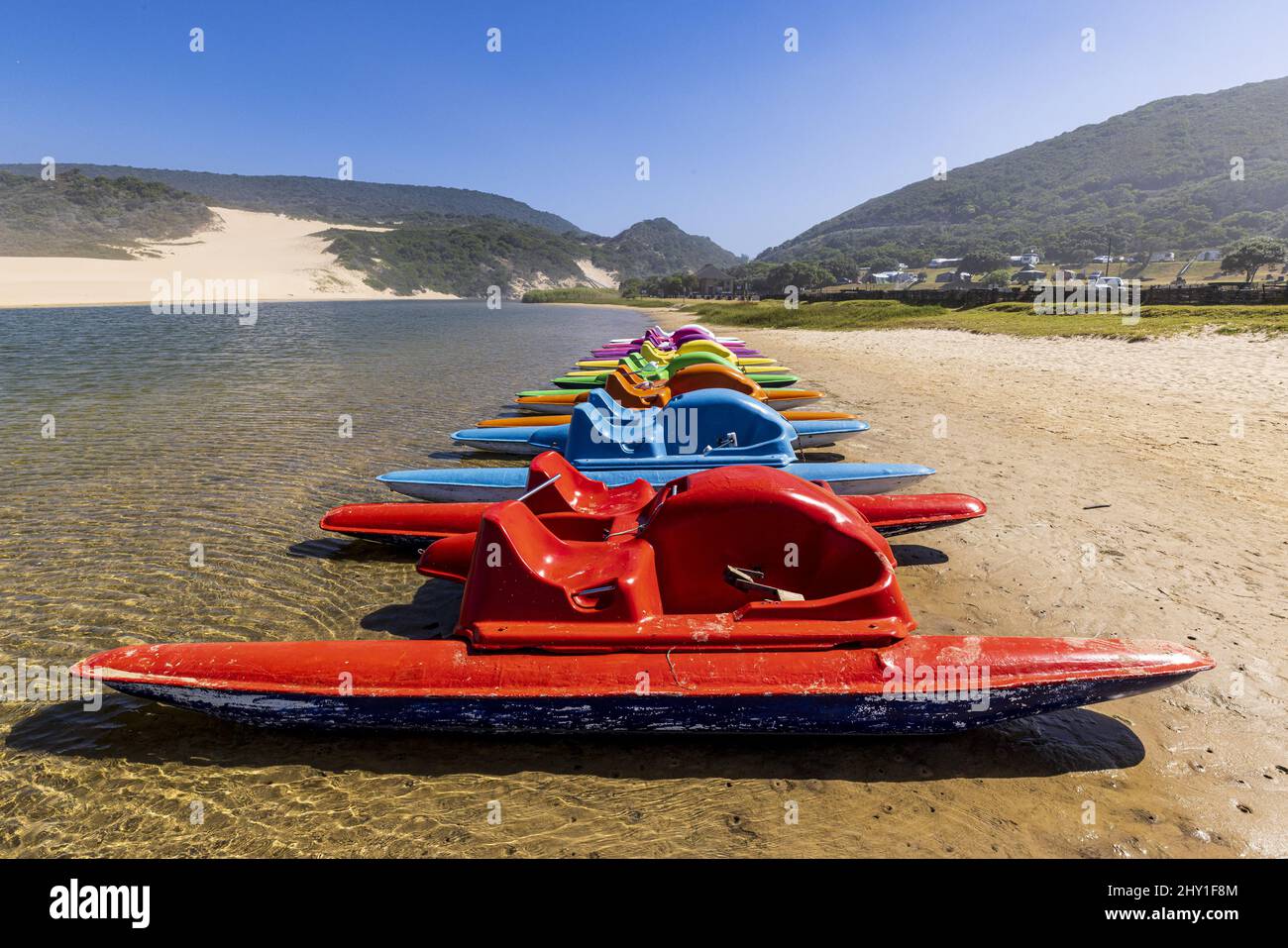 Pedal Boats on a sandy beach next to a body of water at van Stadens ...