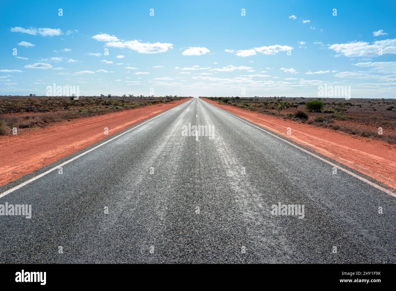 Scenic view of the longest straight road in Australia on cloudy sky ...