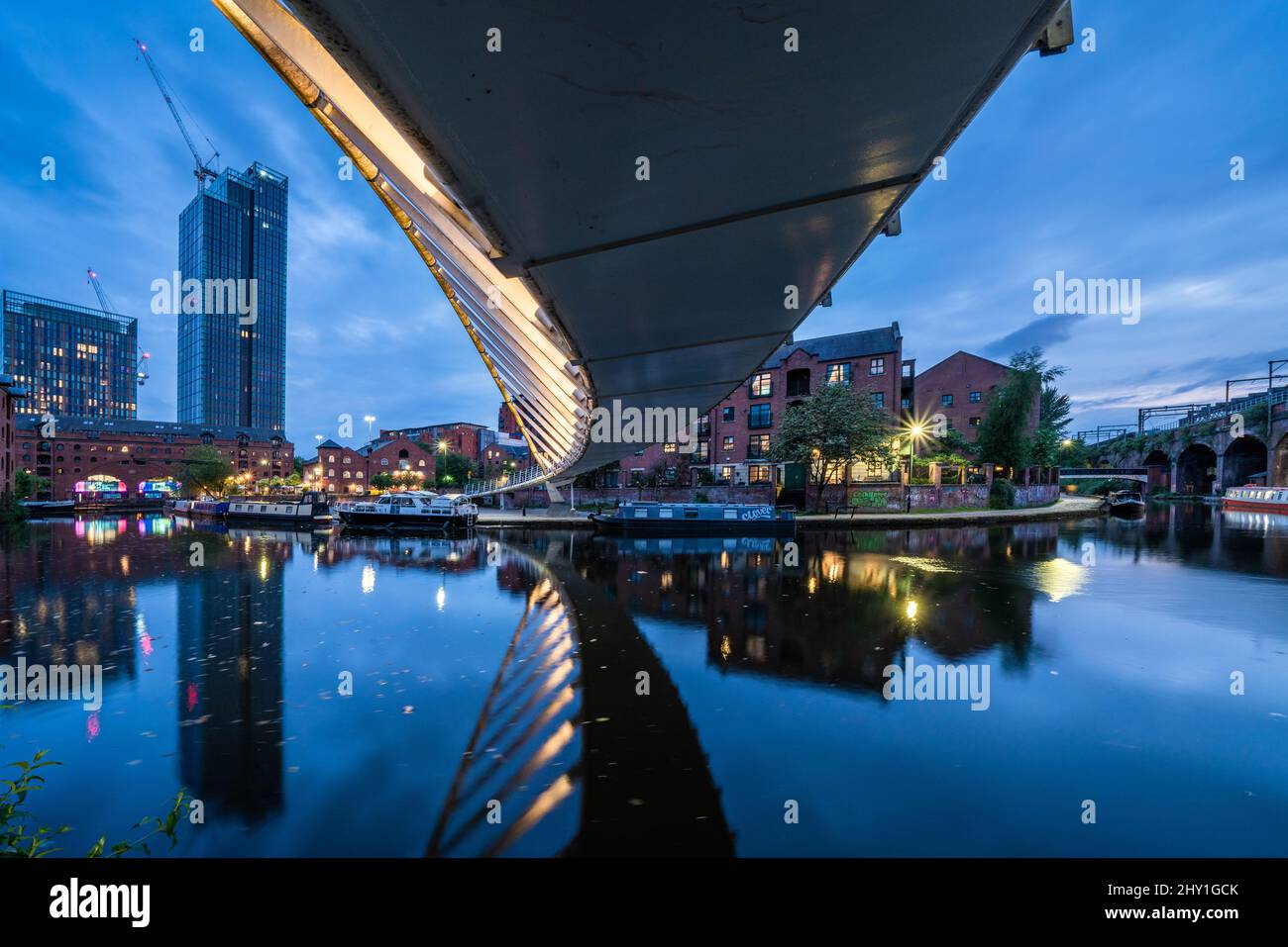 Evening view under the Merchants Bridge along the River Irwell in the ...