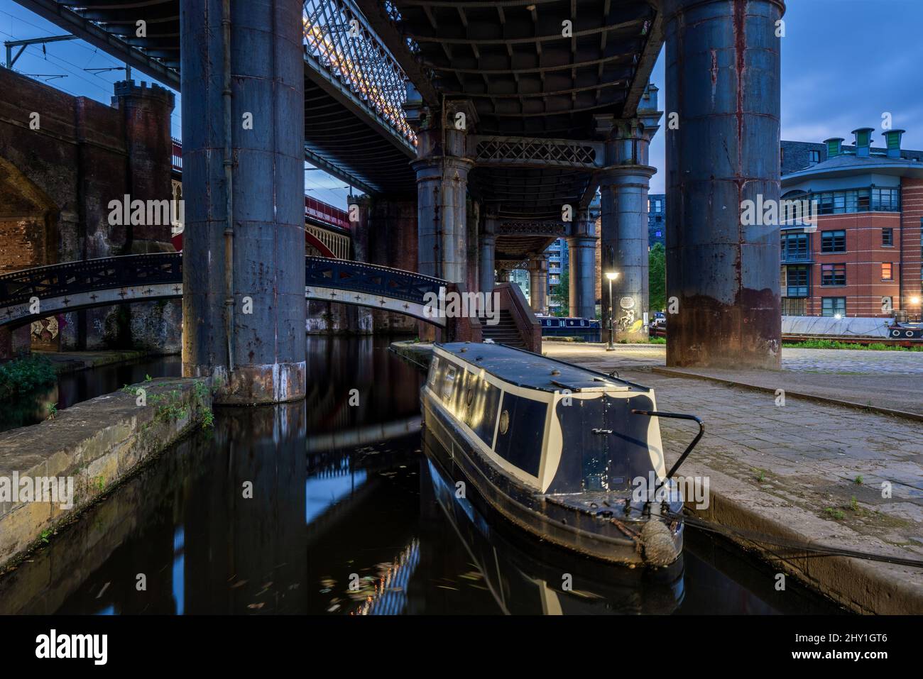Bridges, canals and a boat docked during the evening in the famous ...