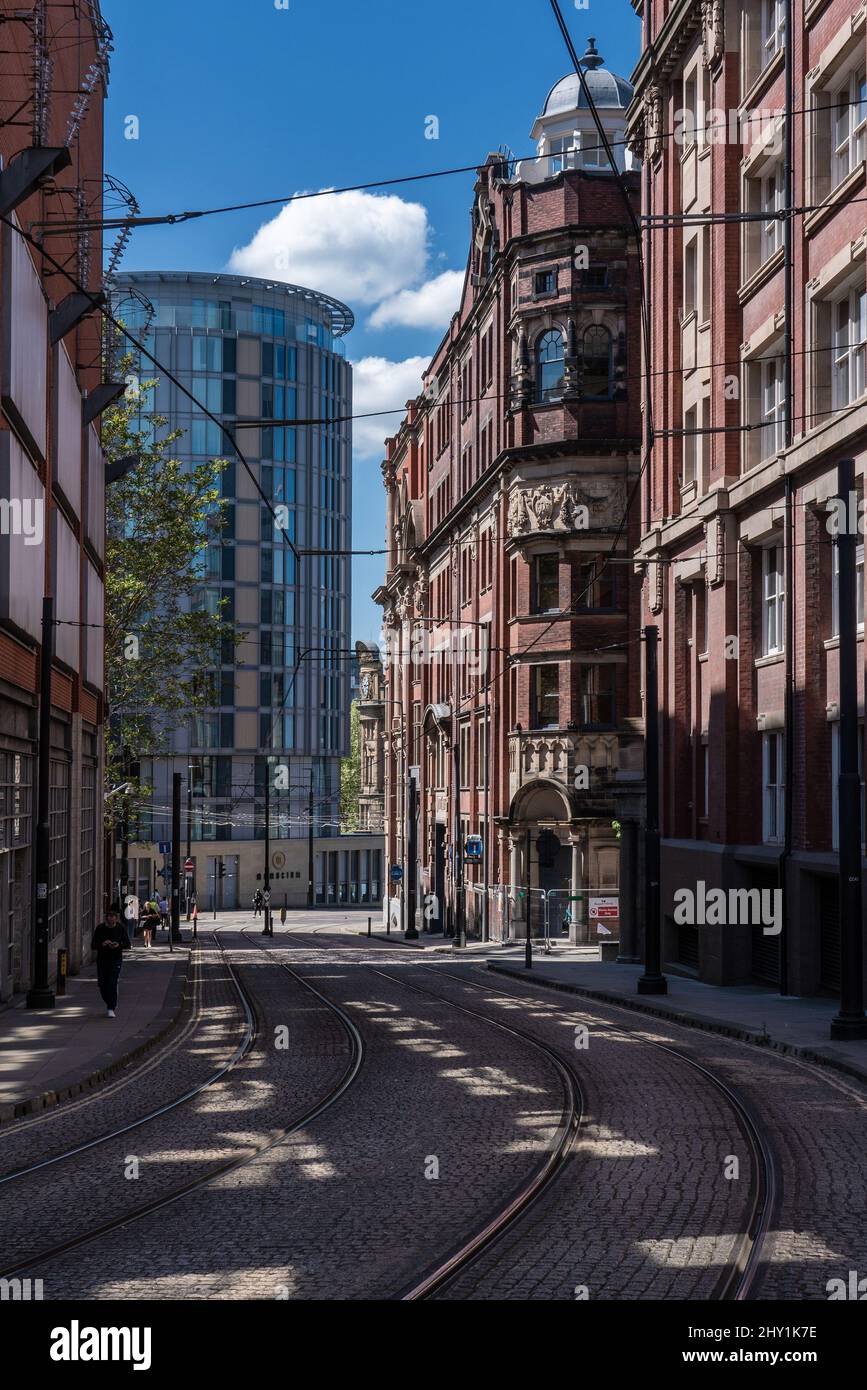 Cityscape of a city centre street with traditional buildings and a tram ...