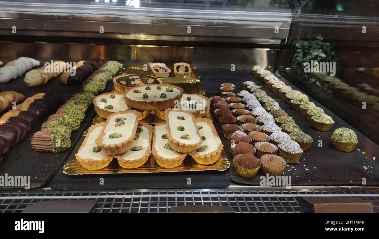 Different types of delicious pastries on a counter Stock Photo - Alamy