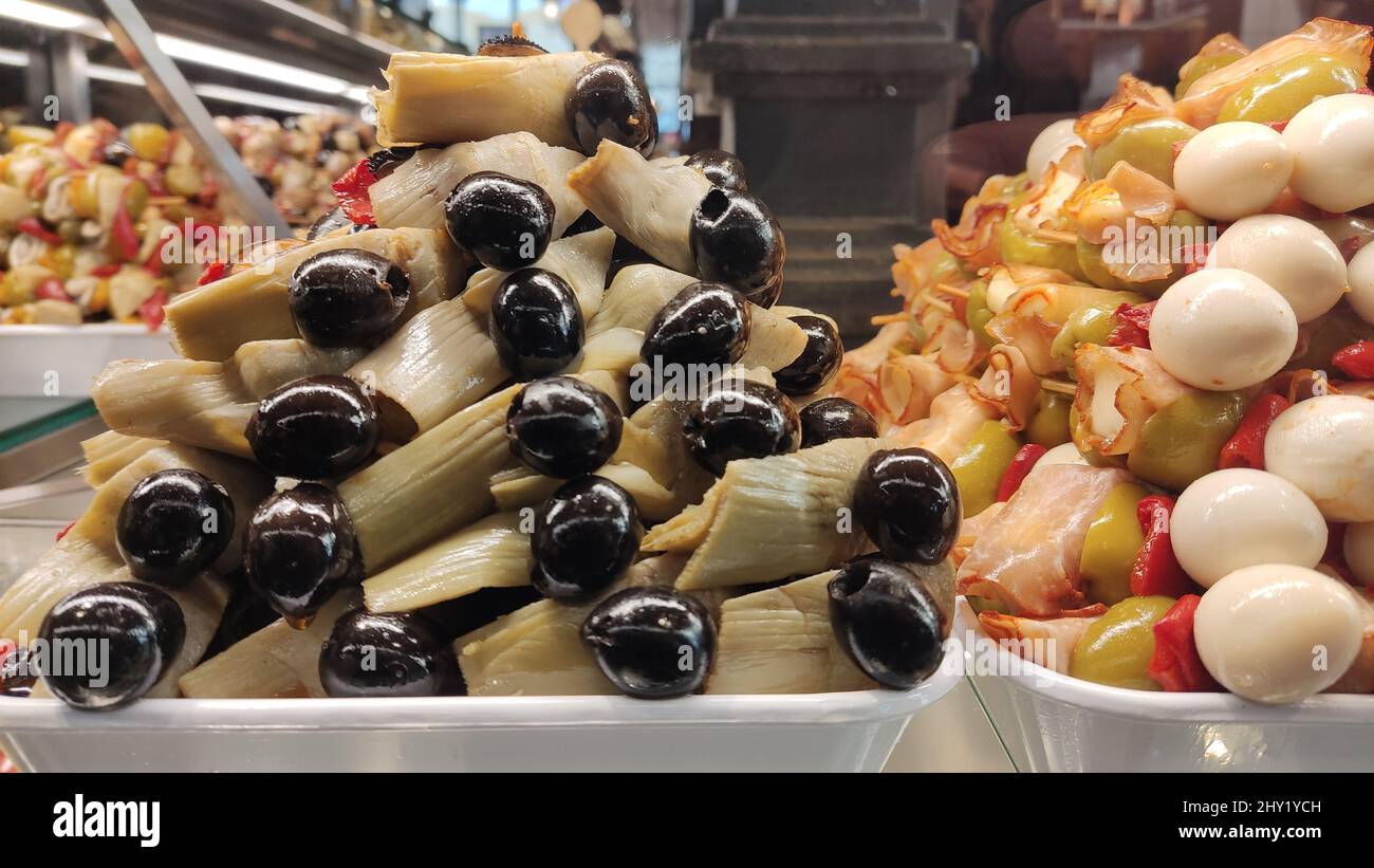 Closeup of canapes with olives and quail's eggs on a counter Stock ...