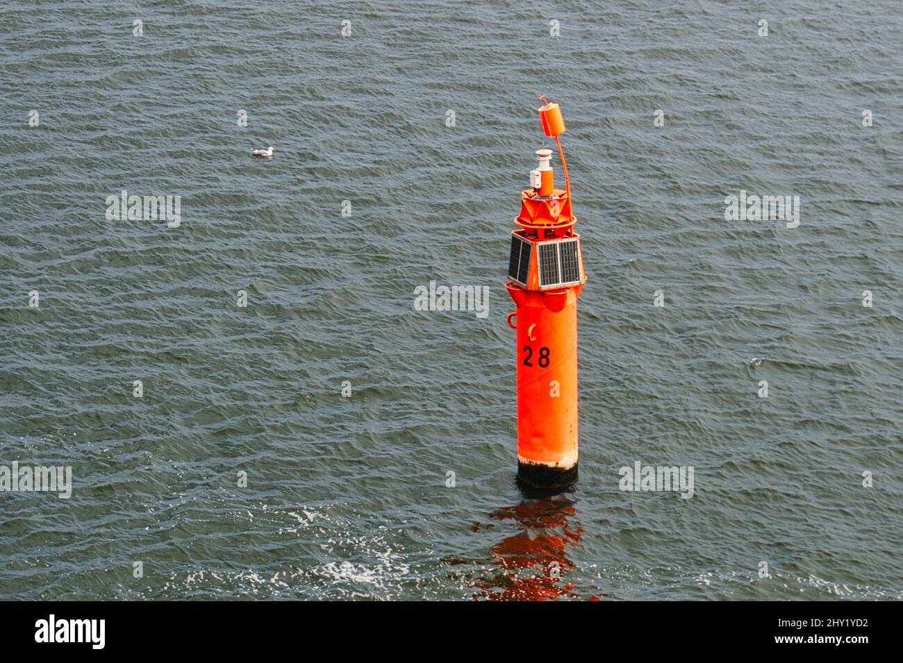 Closeup of a lighthouse in the wavy ocean Stock Photo - Alamy