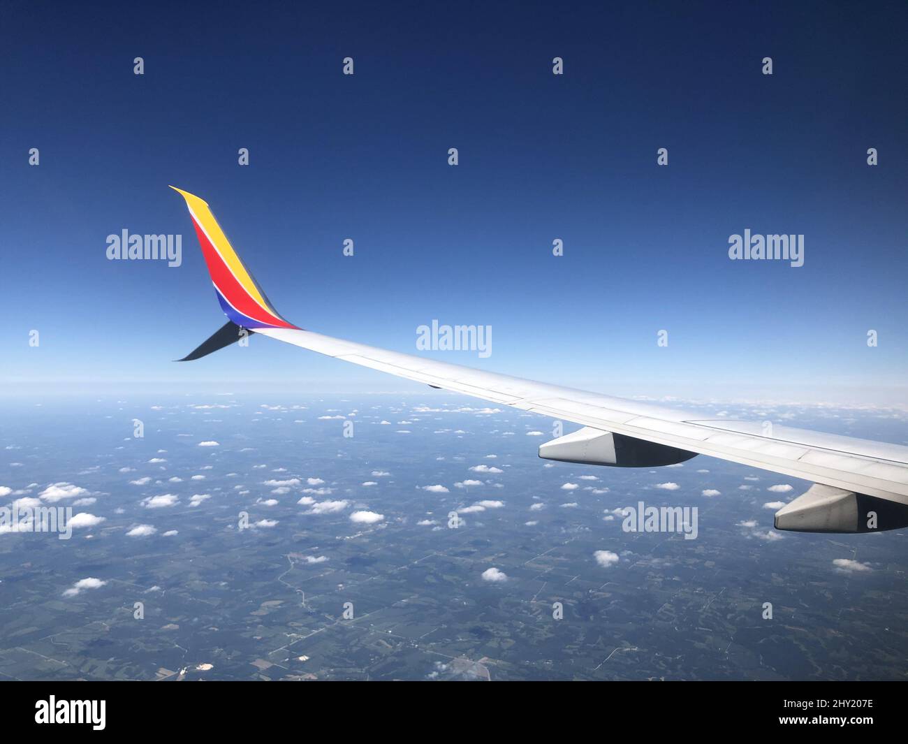 Wing of a commercial airplane during a flight Stock Photo - Alamy