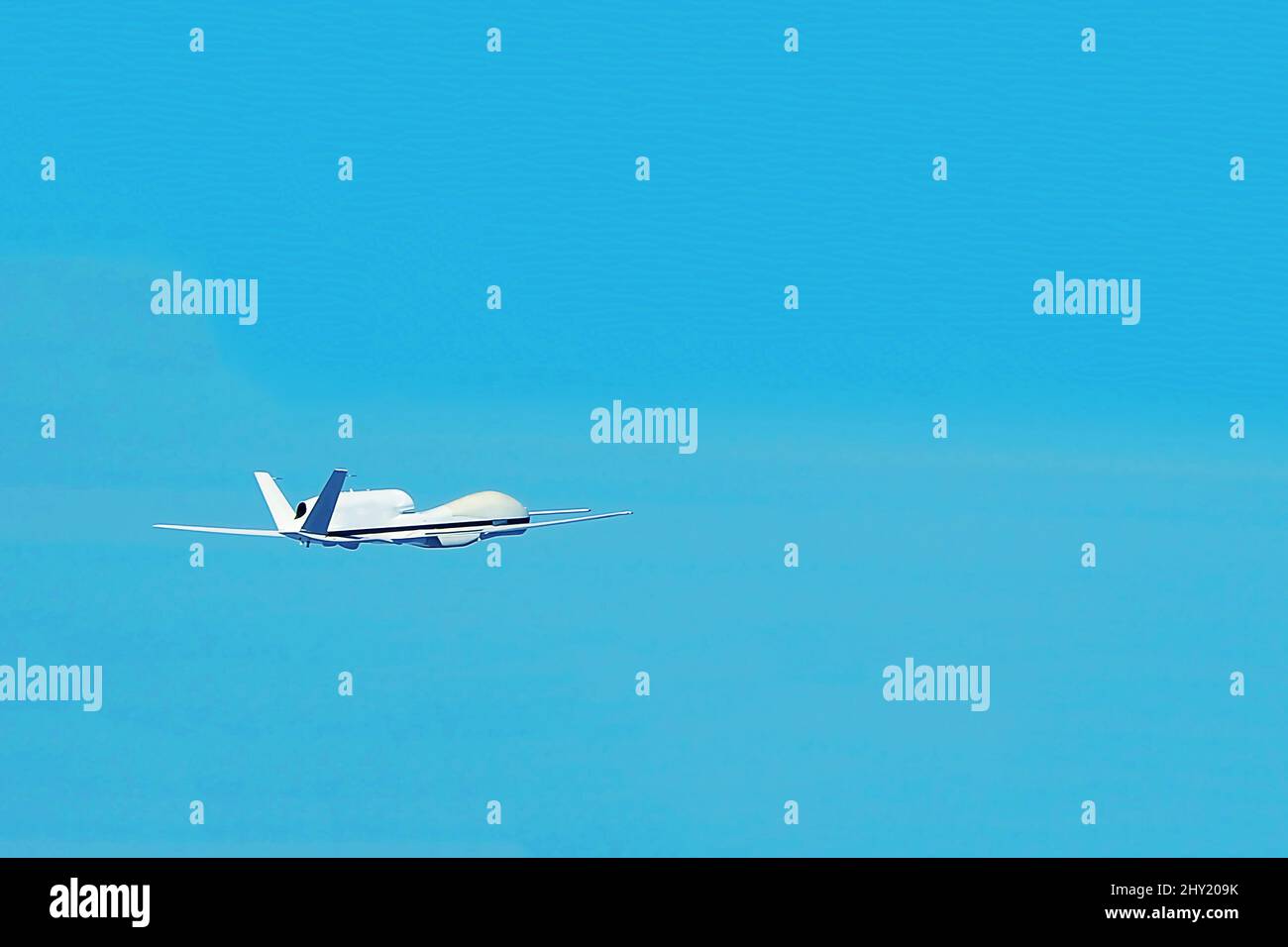 UAV in a cloudless sky. Elements of this image furnished by NASA. High ...