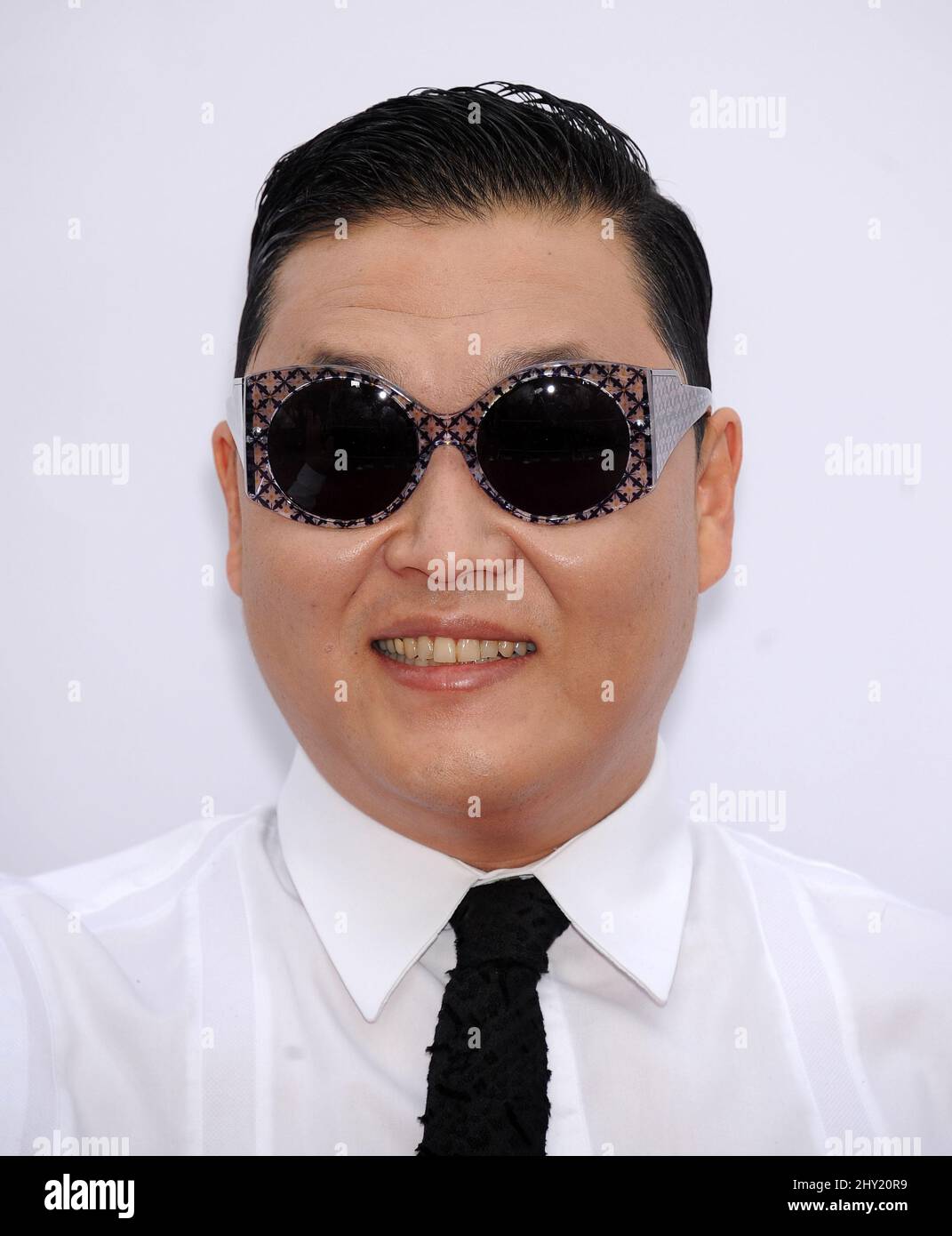 Psy arrives at the LA premiere of "Red 2" at the Westwood Village on ...